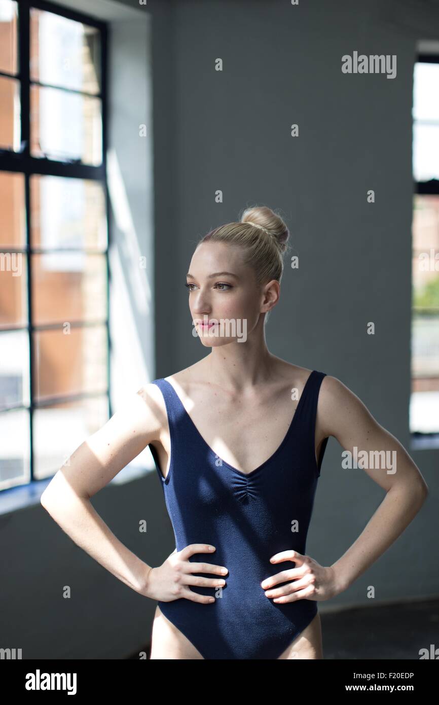 Dancer looking out of window in studio Stock Photo - Alamy