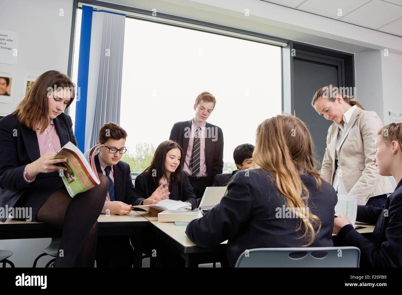 Group of classmates studying in classroom Stock Photo - Alamy