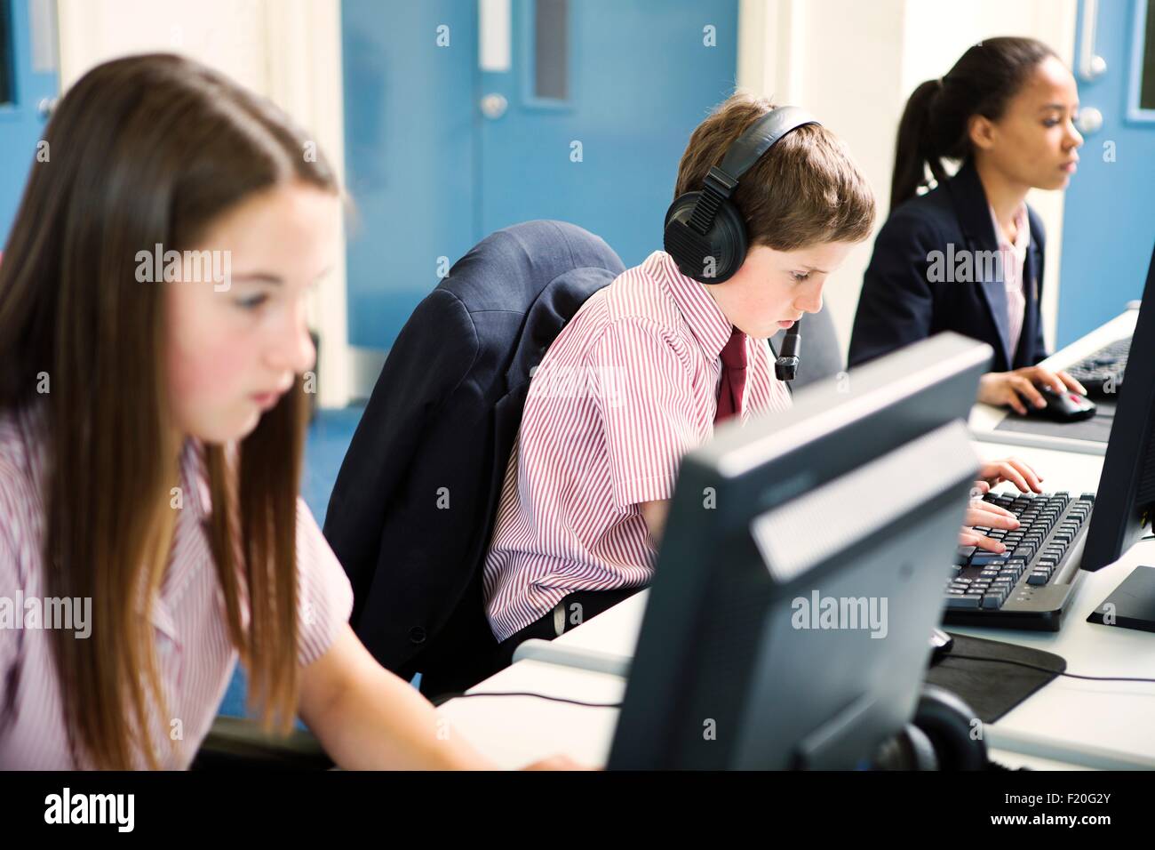 Students using computer in classroom Stock Photo - Alamy