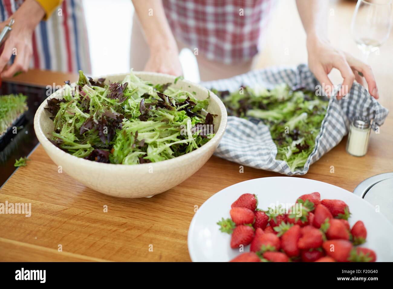 Women preparing meal in kitchen Stock Photo - Alamy