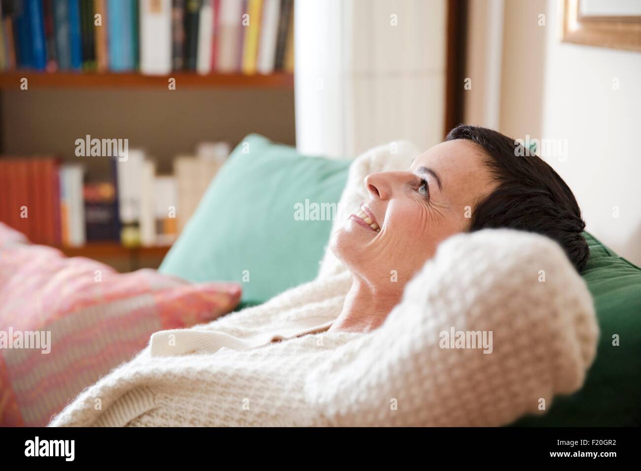 Woman relaxing at home Stock Photo - Alamy