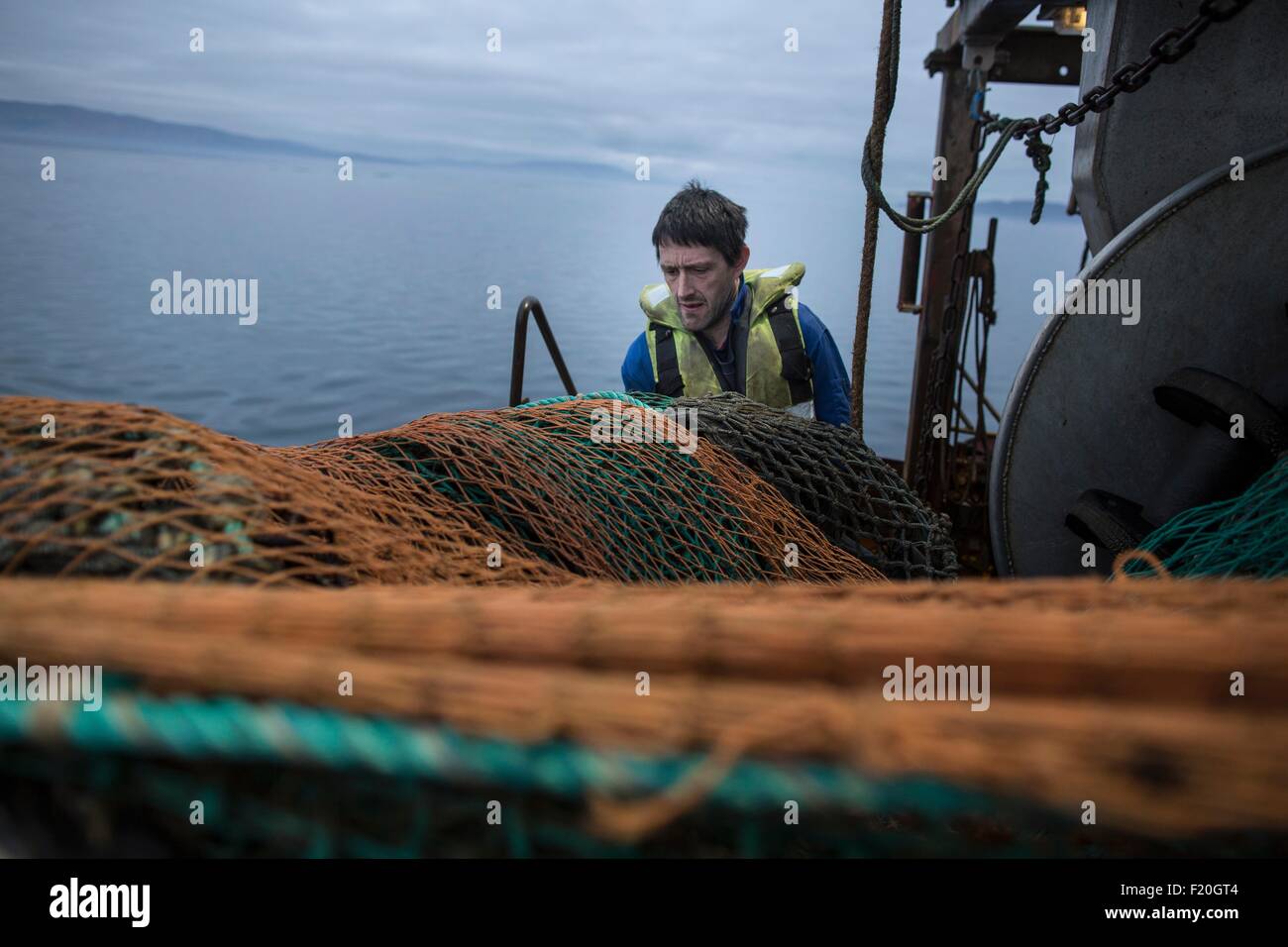 Fisherman preparing net, Isle of Skye, Scotland Stock Photo - Alamy