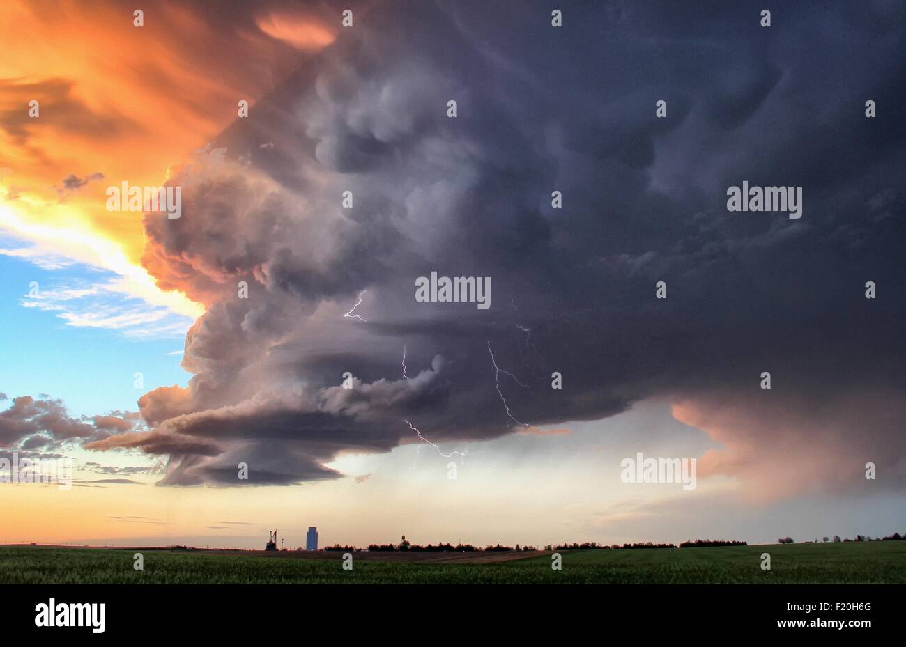 Mesocyclone spinning away, ejecting lightning out of vault at sunset ...