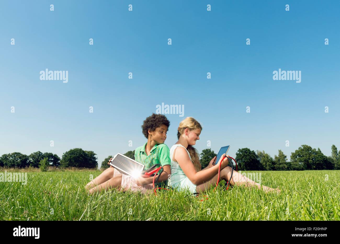 Boy sitting back view hi-res stock photography and images - Alamy