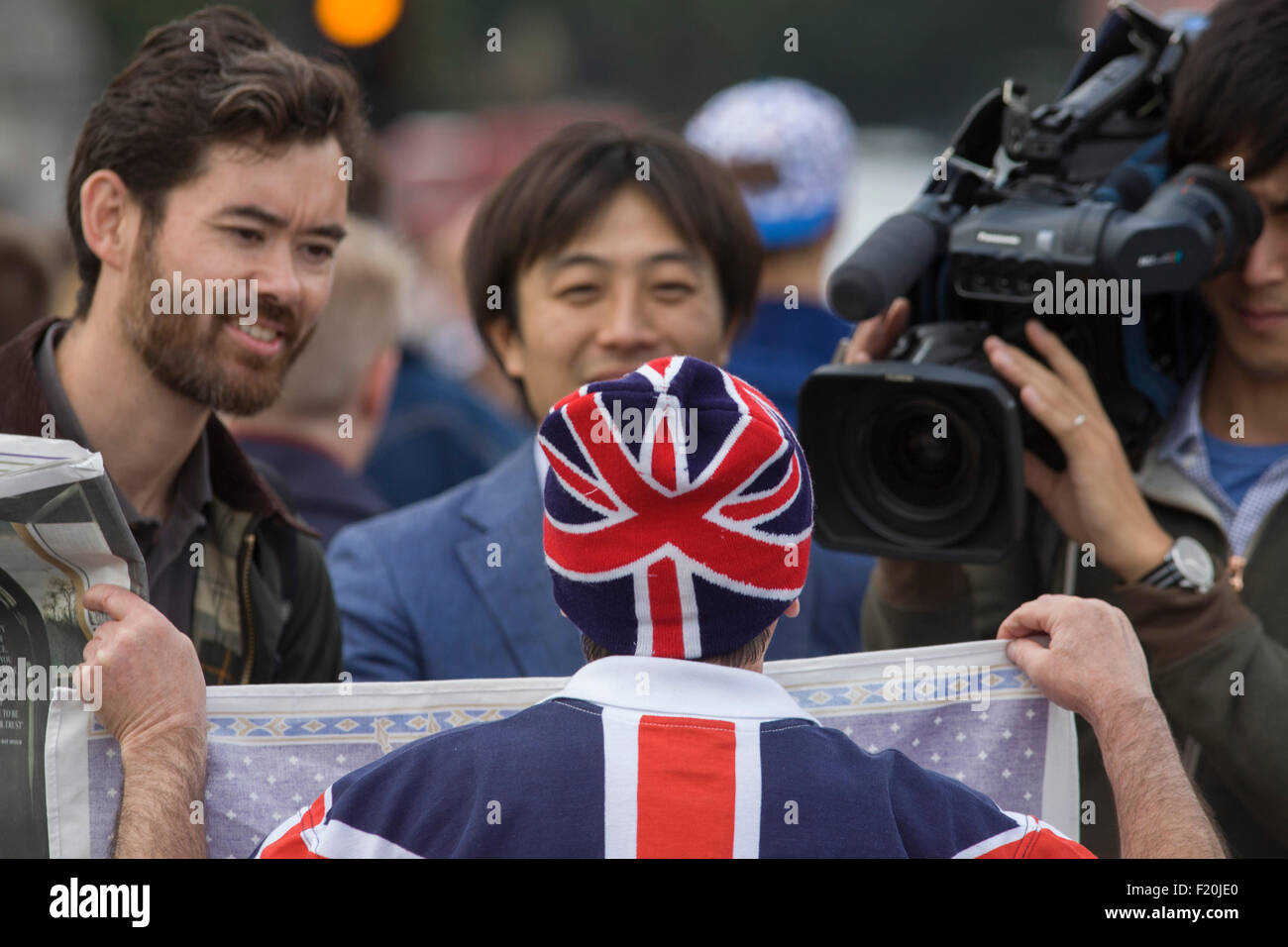 An Asian tv crew interview a royalist during celebrations of the Queen ...