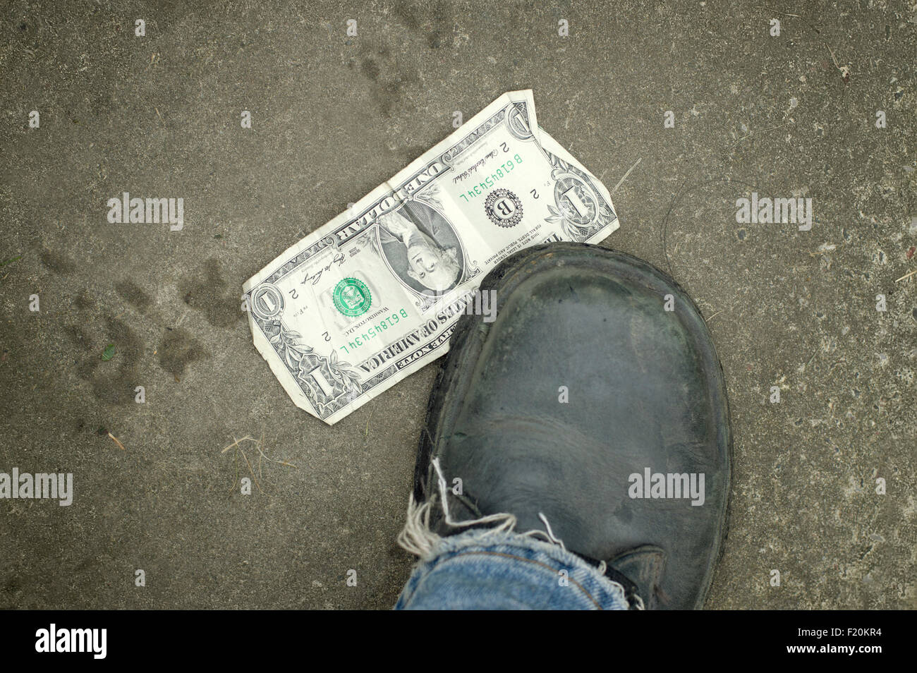 Dollar Under Foot Stock Photo - Alamy