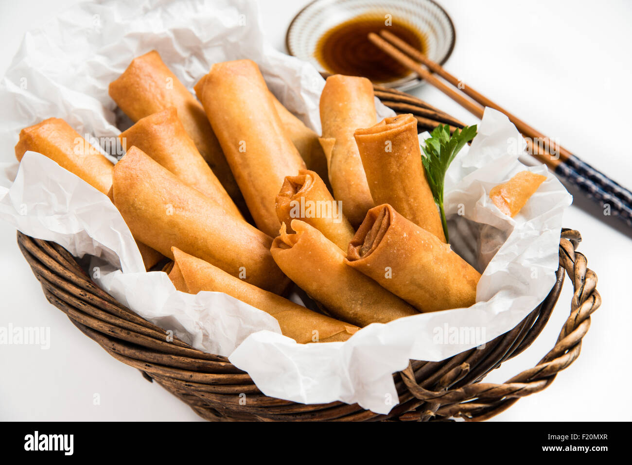 Traditional Asian Fried Spring Rolls with Dipping Sauce on White ...