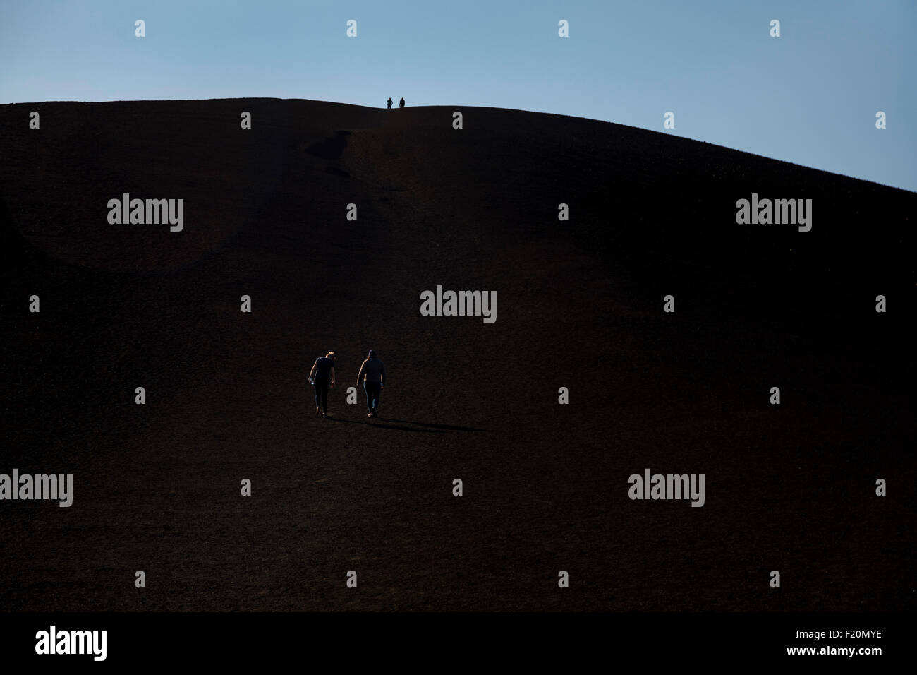 Arco, Idaho - People climb the Inferno Cone at Craters of the Moon ...