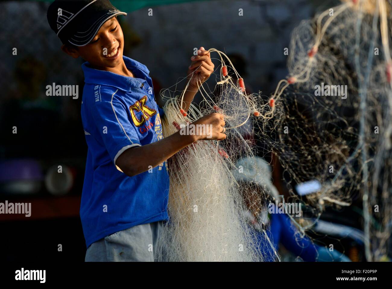 Cleaning nets on beach hi-res stock photography and images - Alamy