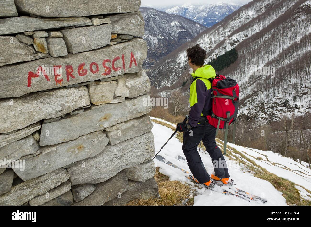 Switzerland, Ticino, Locarno, ski touring across abandoned villages to ...