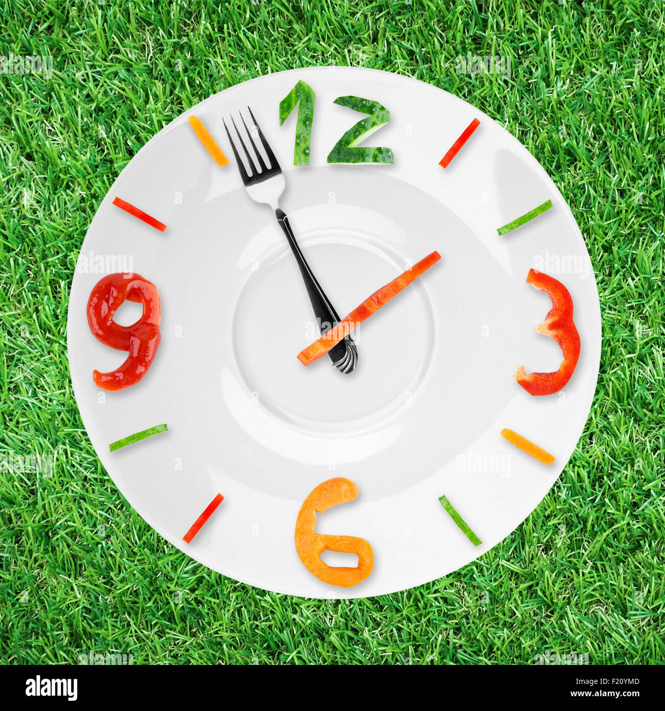 Food clock. Healthy food concept Stock Photo - Alamy