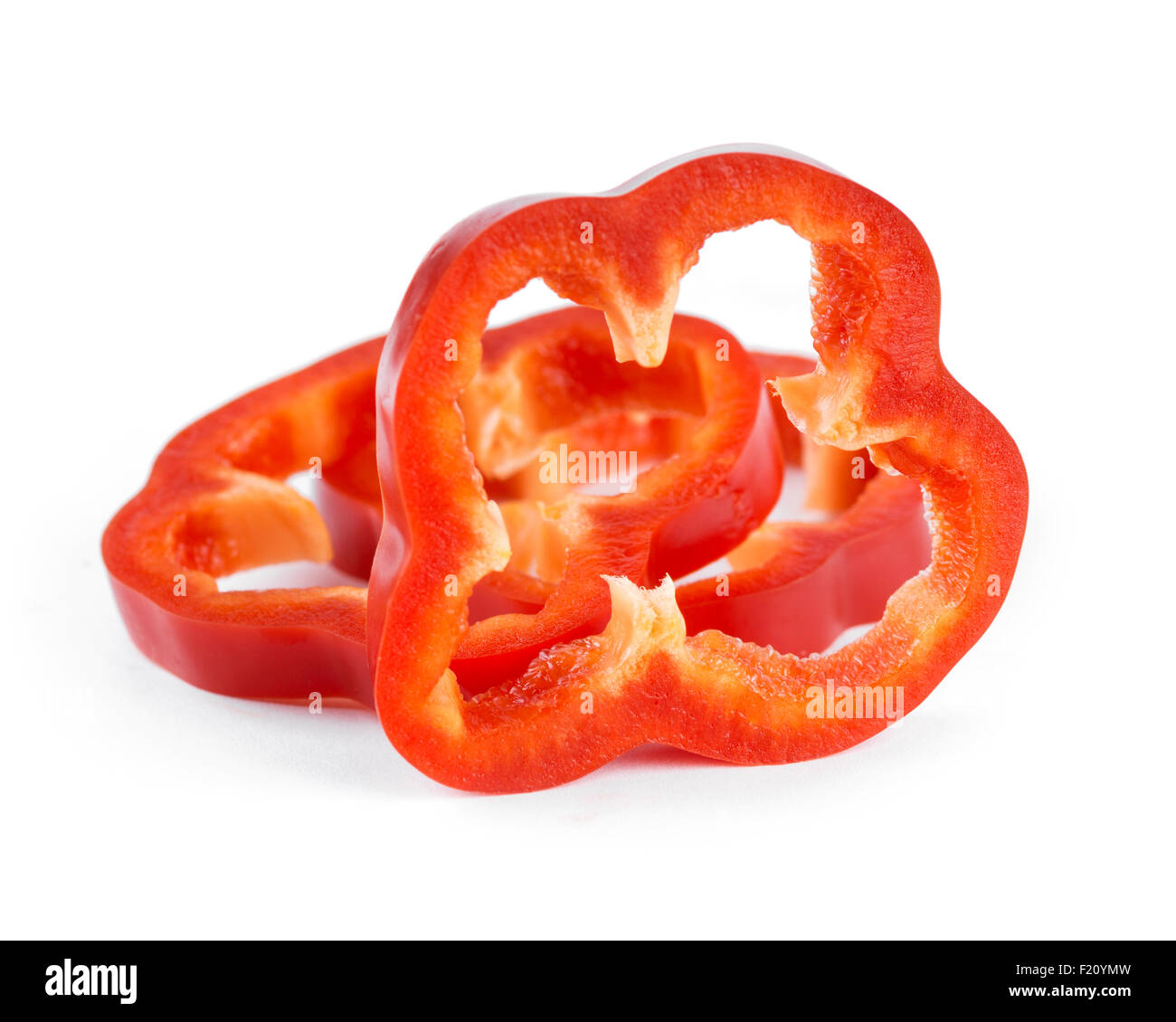 Pepper slices closeup on white background Stock Photo - Alamy