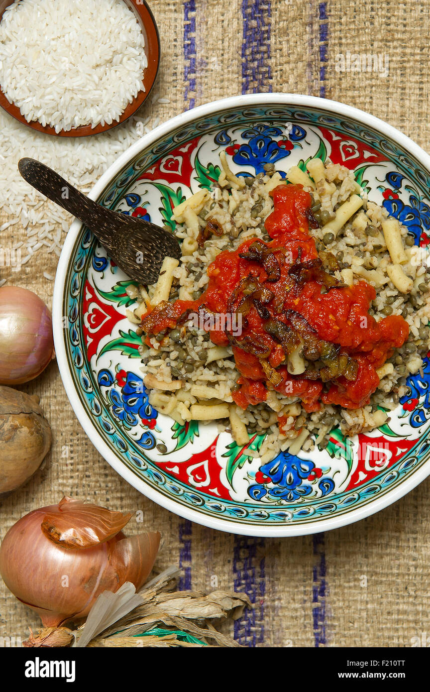 Koshari (Egyptian street food) made with rice, lentils, pasta, boiled ...