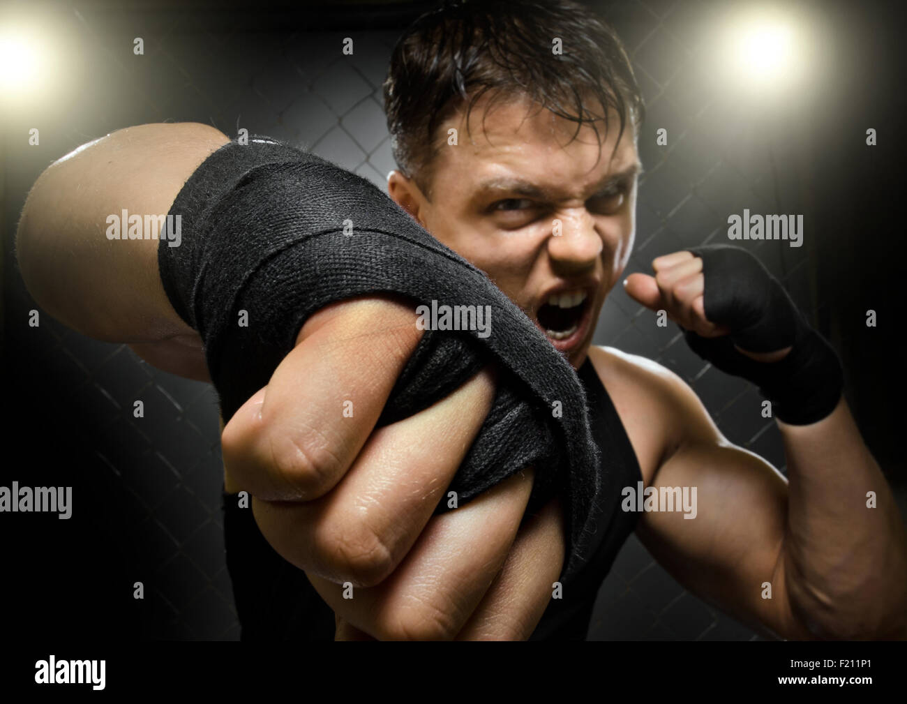 horizontal photo muscular young guy street-fighter, cuff fist close up ...