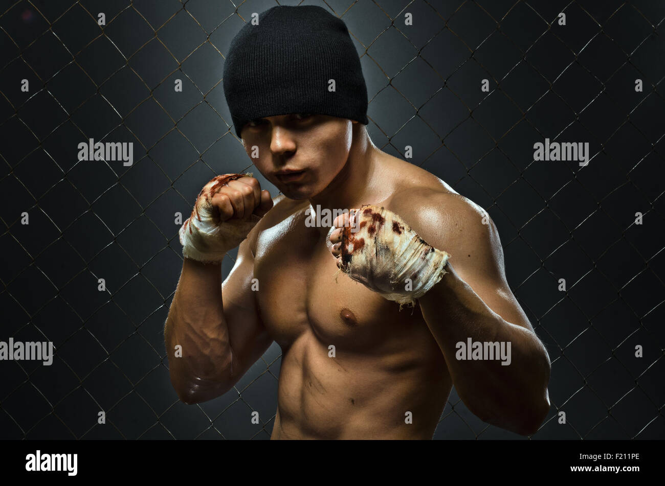 horizontal photo muscular young guy street-fighter, aggression look ...
