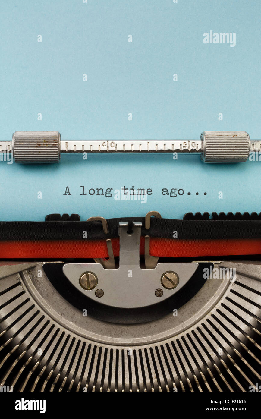 Vintage Typewriter With Phrase "A long time ago" Typed on Blue Paper ...