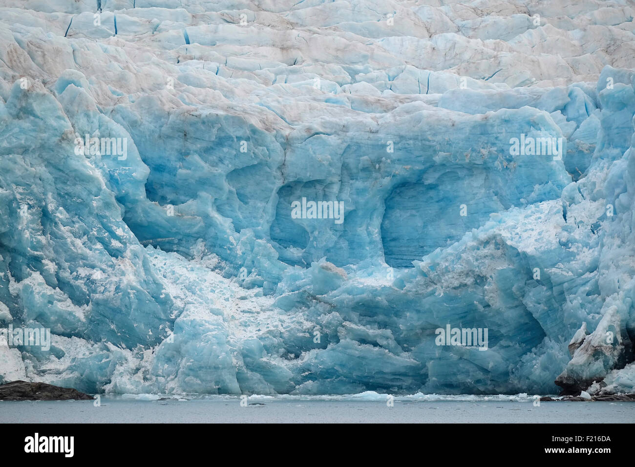 Norway, Svalbard, NordenskiÃ¶ld Glacier, Blue ice, Ice worn rock ...