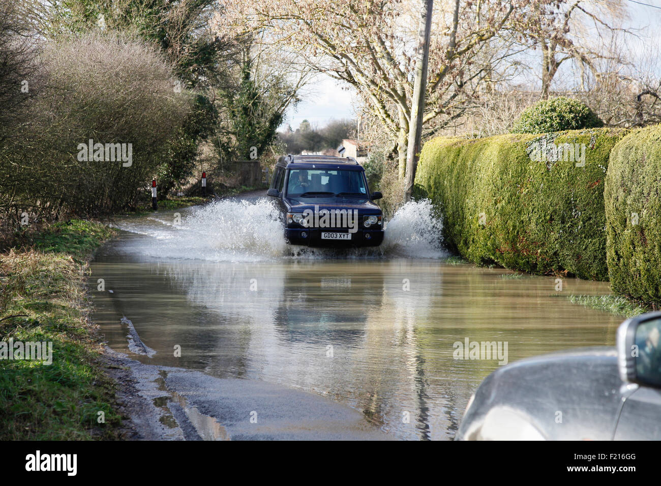 Climate, Weather, Flooding, Cars driving through floodwater Stock Photo ...