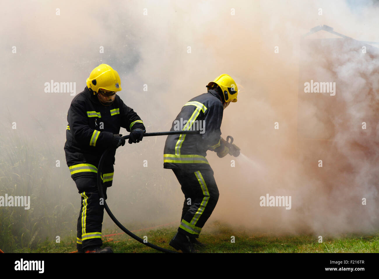 Putting out fire hi-res stock photography and images - Alamy