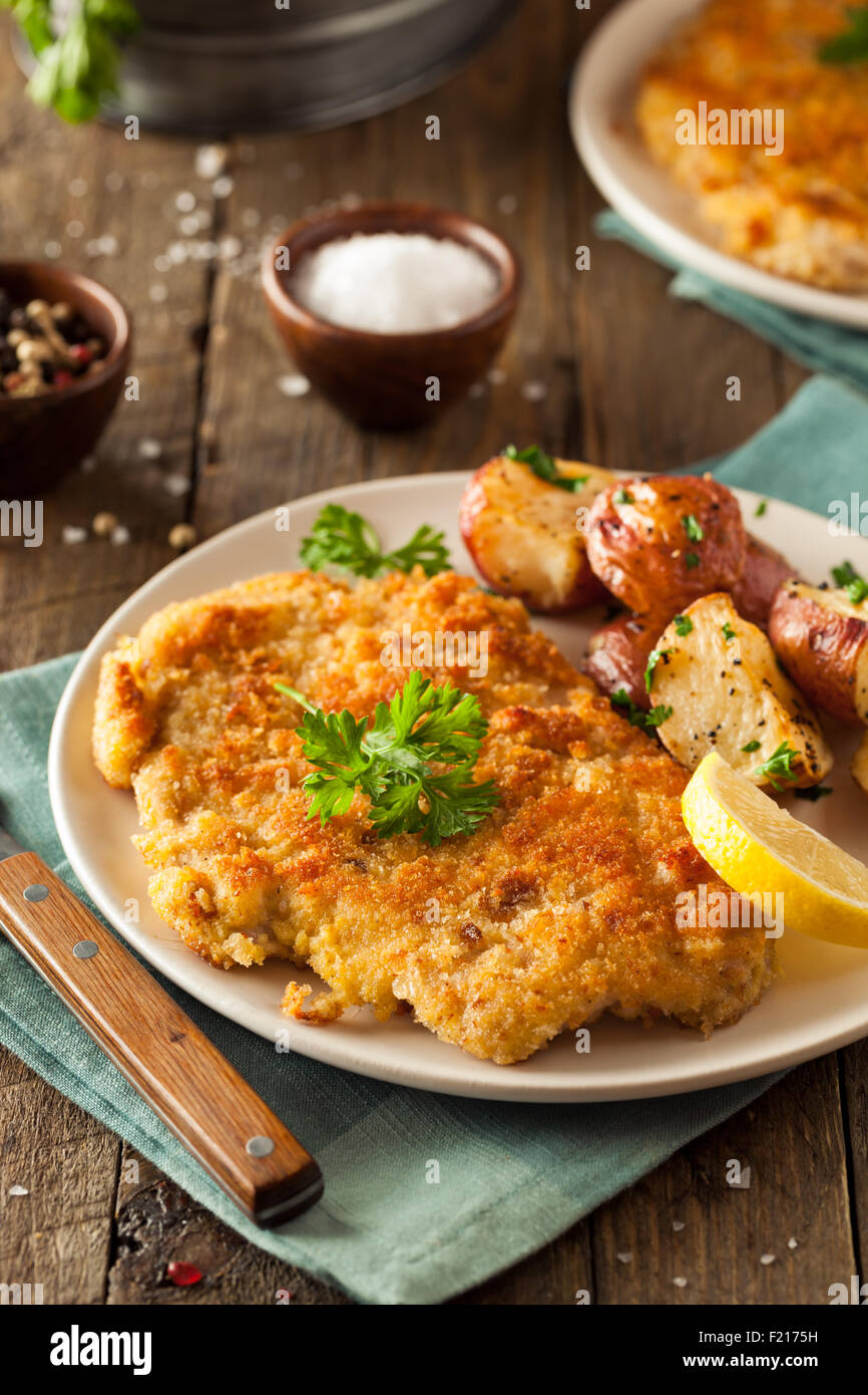 Homemade Breaded German Weiner Schnitzel with Potatoes Stock Photo - Alamy