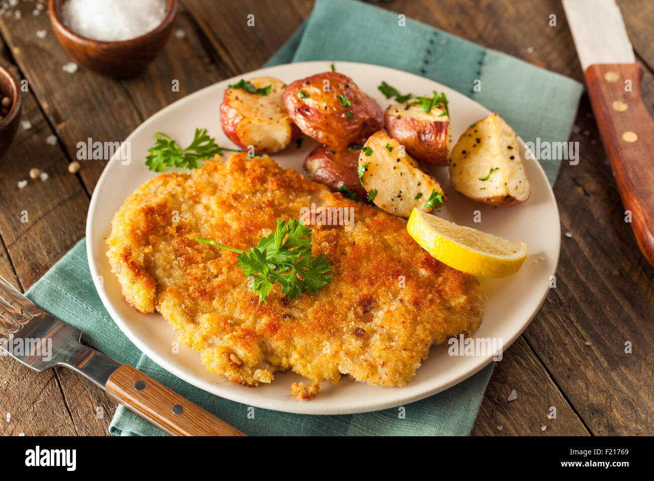 Homemade Breaded German Weiner Schnitzel with Potatoes Stock Photo - Alamy