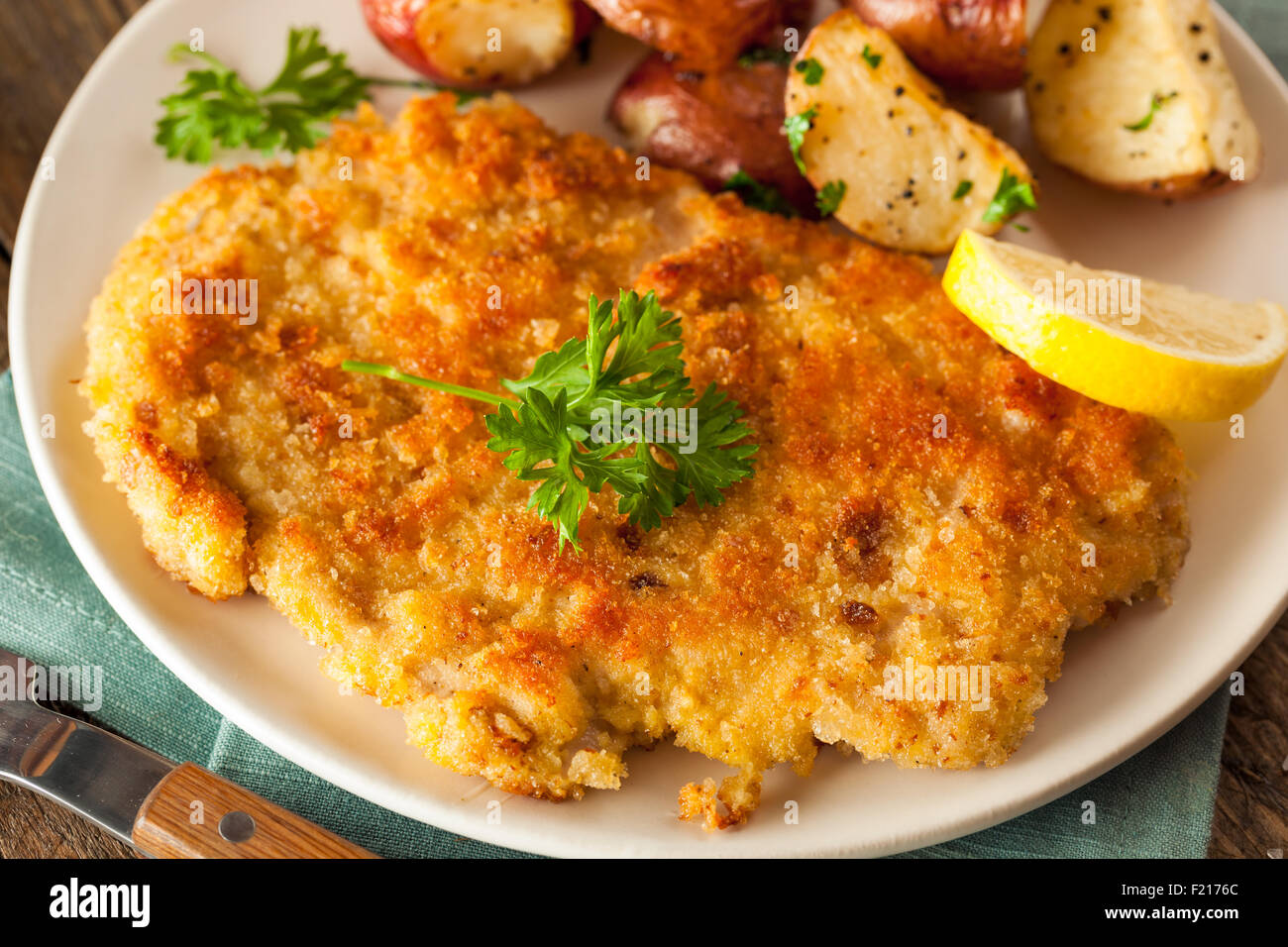Homemade Breaded German Weiner Schnitzel with Potatoes Stock Photo - Alamy