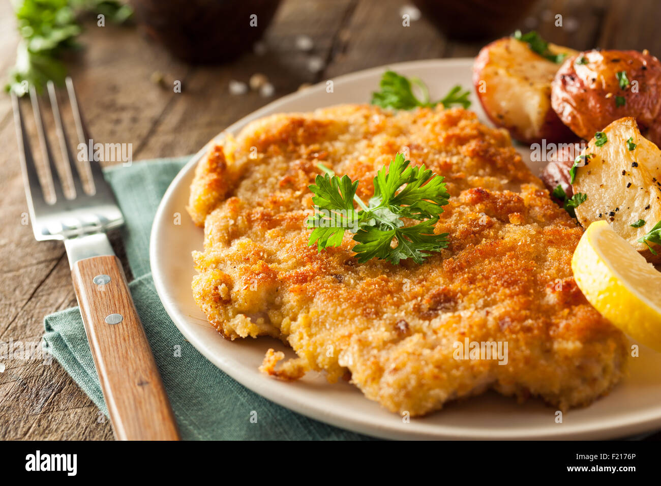 Homemade Breaded German Weiner Schnitzel with Potatoes Stock Photo - Alamy