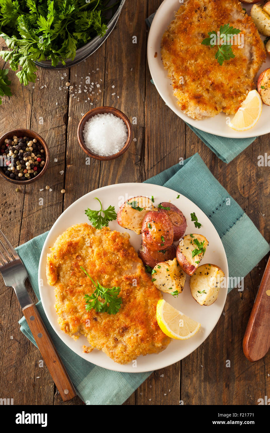 Homemade Breaded German Weiner Schnitzel with Potatoes Stock Photo - Alamy