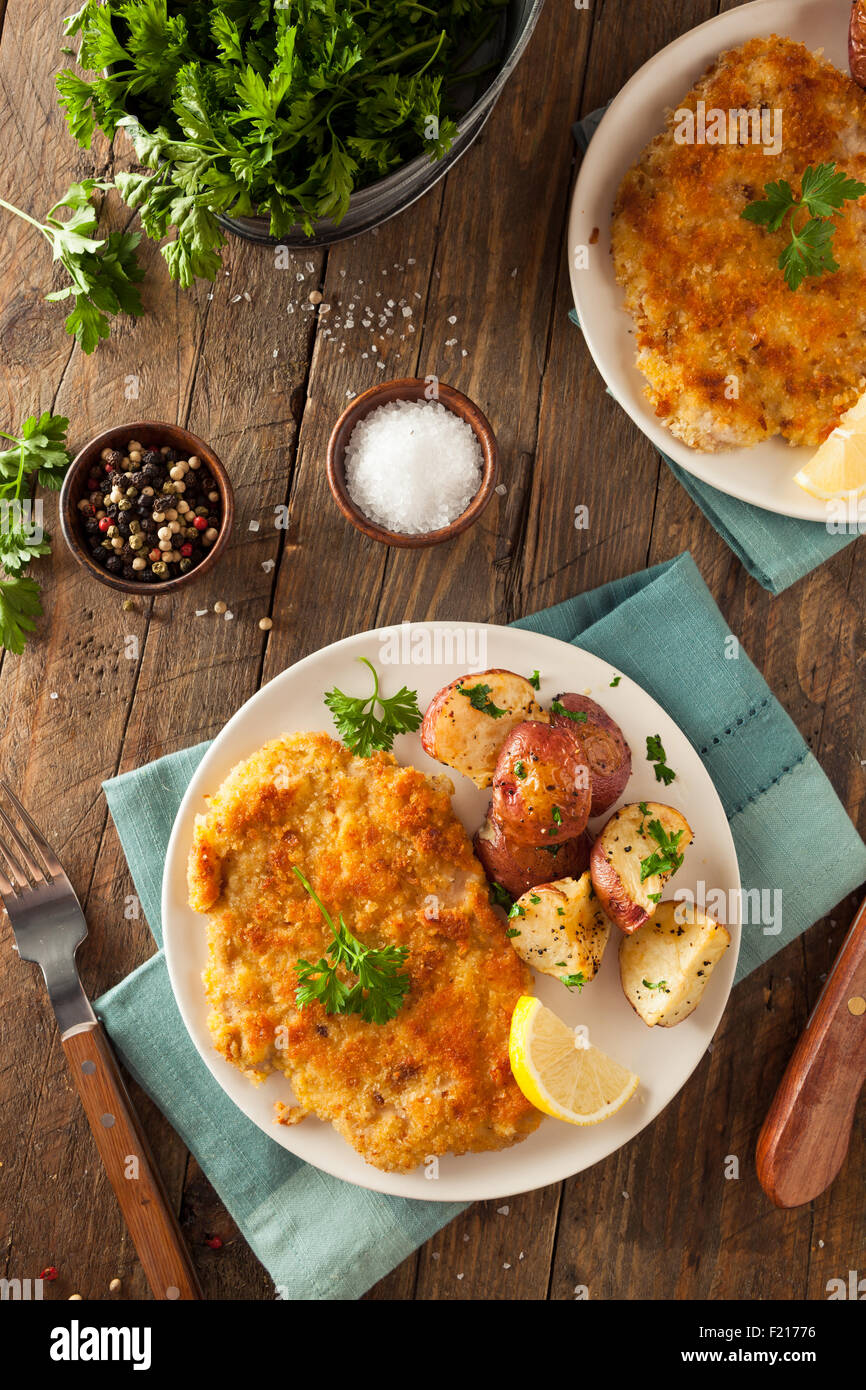 Homemade Breaded German Weiner Schnitzel with Potatoes Stock Photo - Alamy