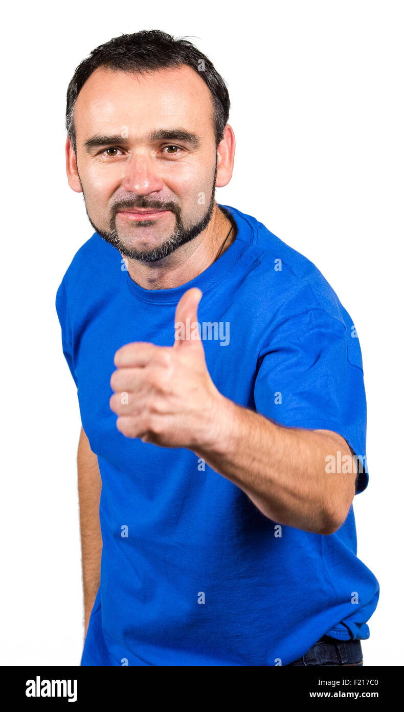Positive bearded man wearing blue shirt showing thumb up isolated on ...