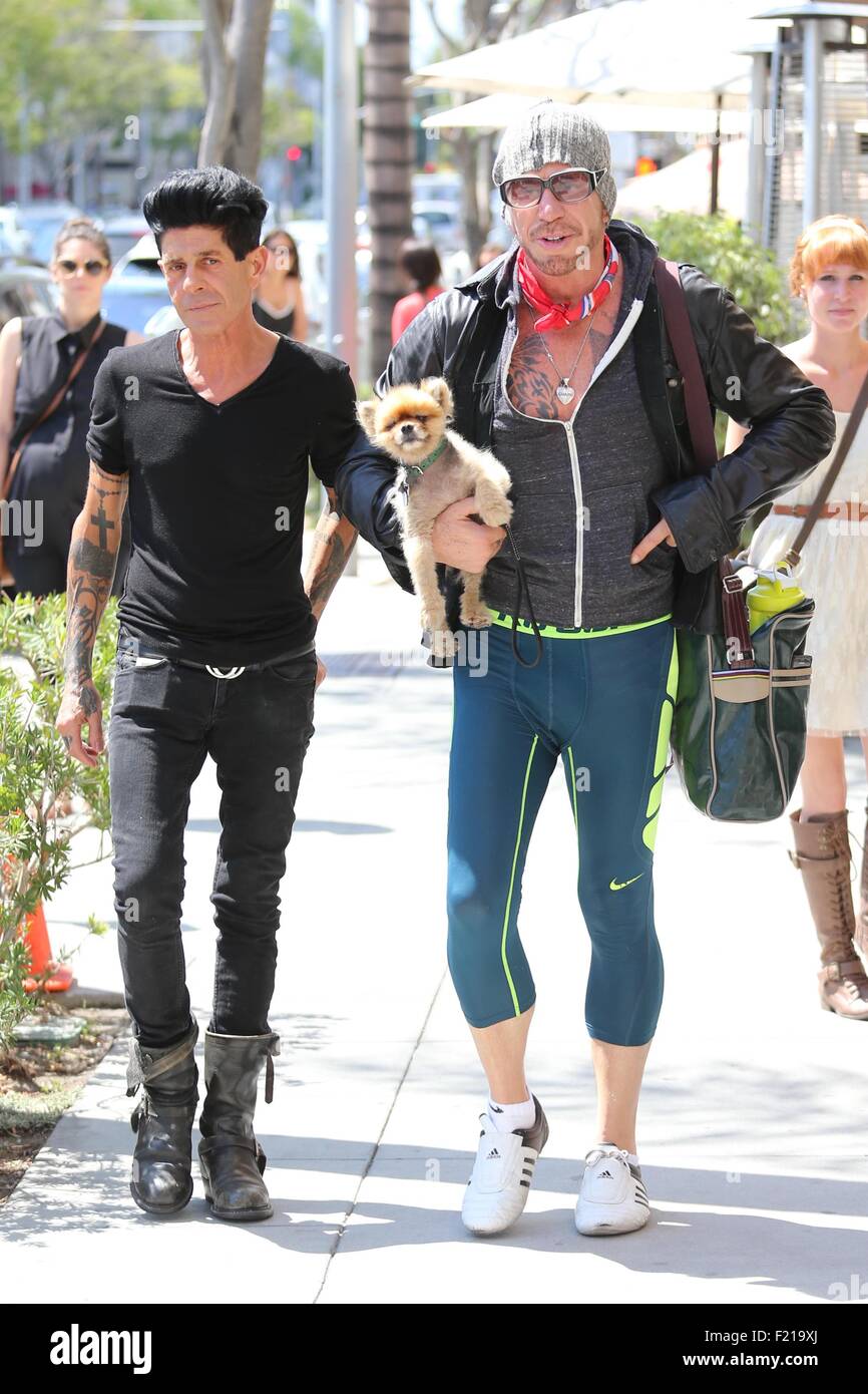 Mickey Rourke steps out for lunch at Cafe Roma with one of his dogs and ...