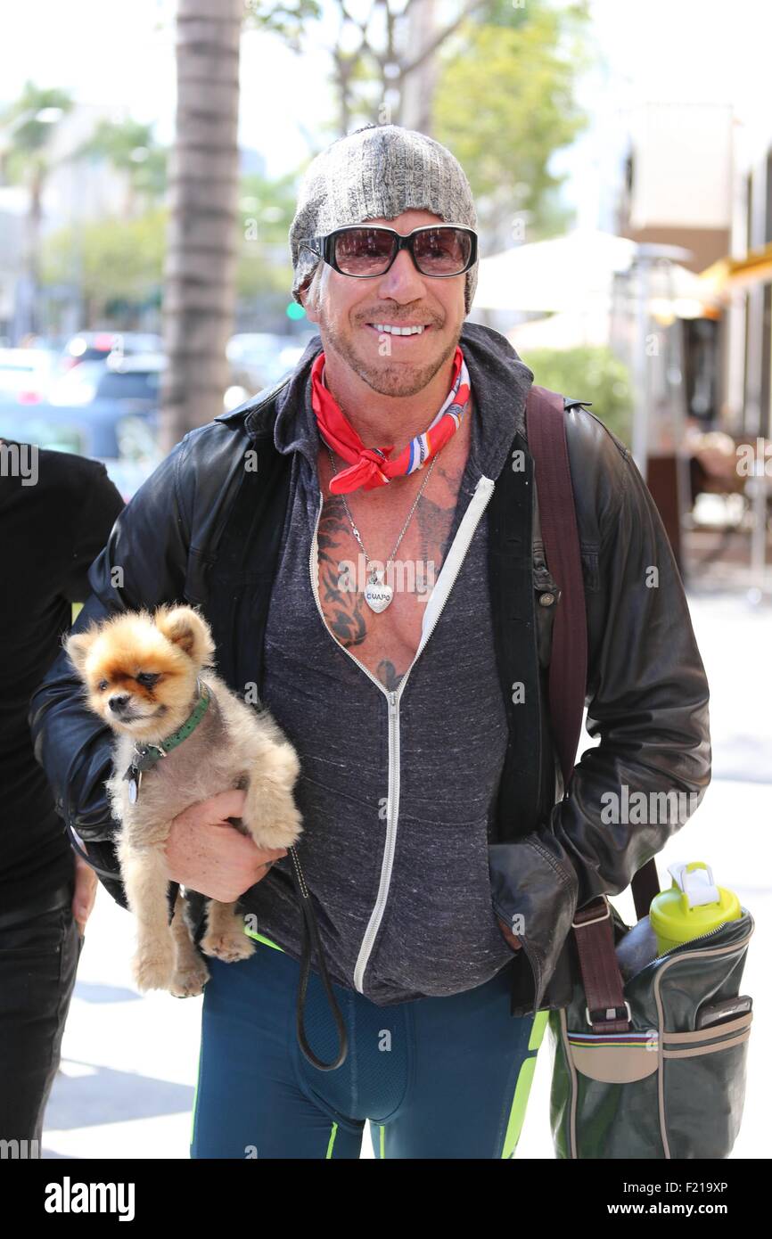 Mickey Rourke steps out for lunch at Cafe Roma with one of his dogs and ...