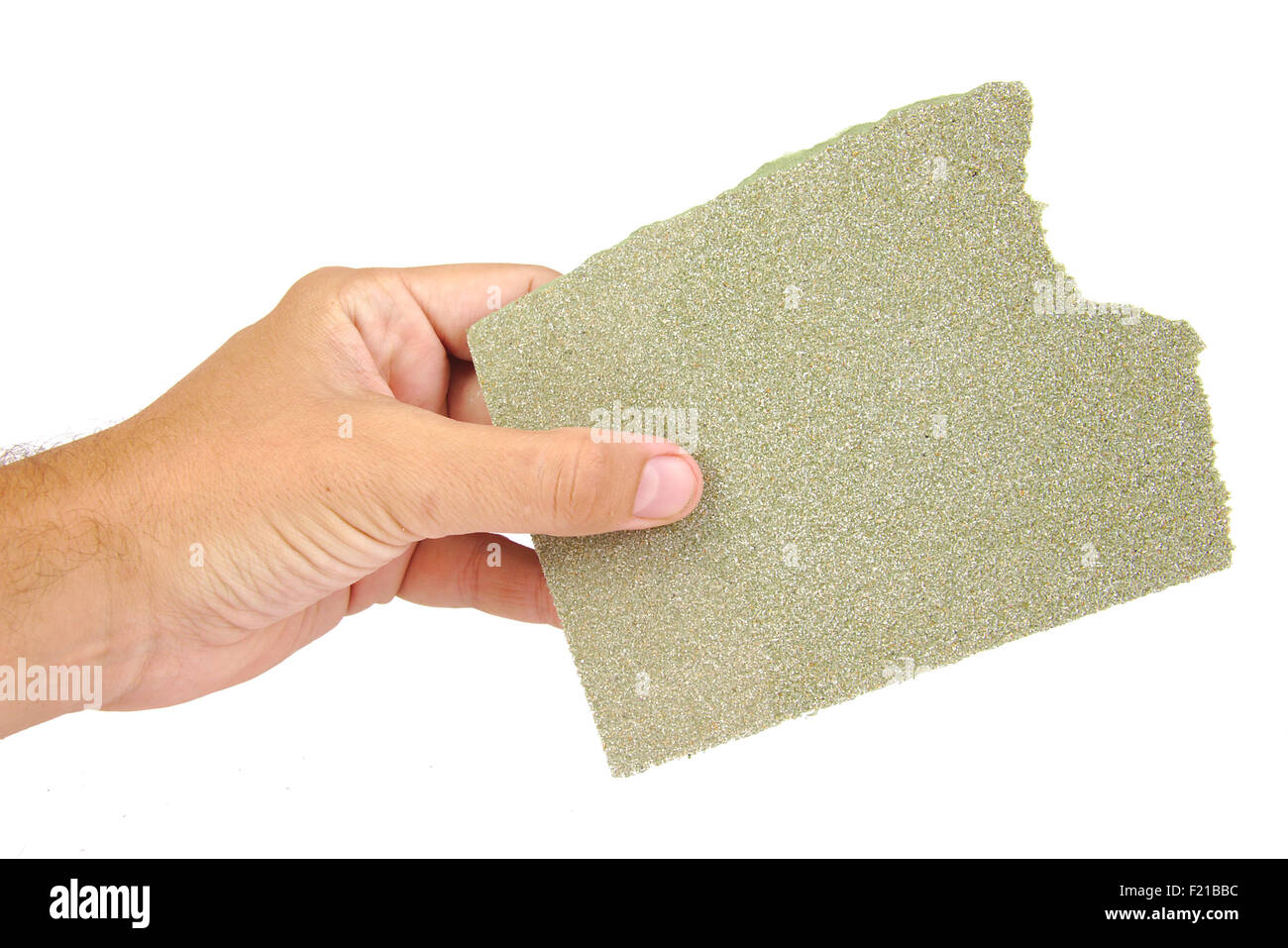 Hand holding sanding sheet isolated on white background Stock Photo - Alamy