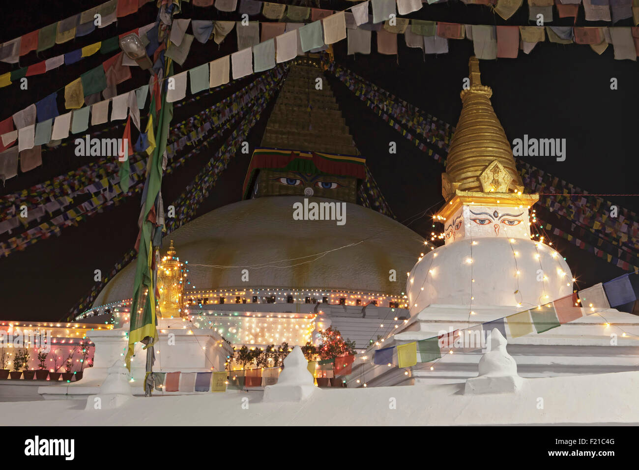 Nepal Kathmandu Night view of the Great Stupa and a mini-stupa in front ...