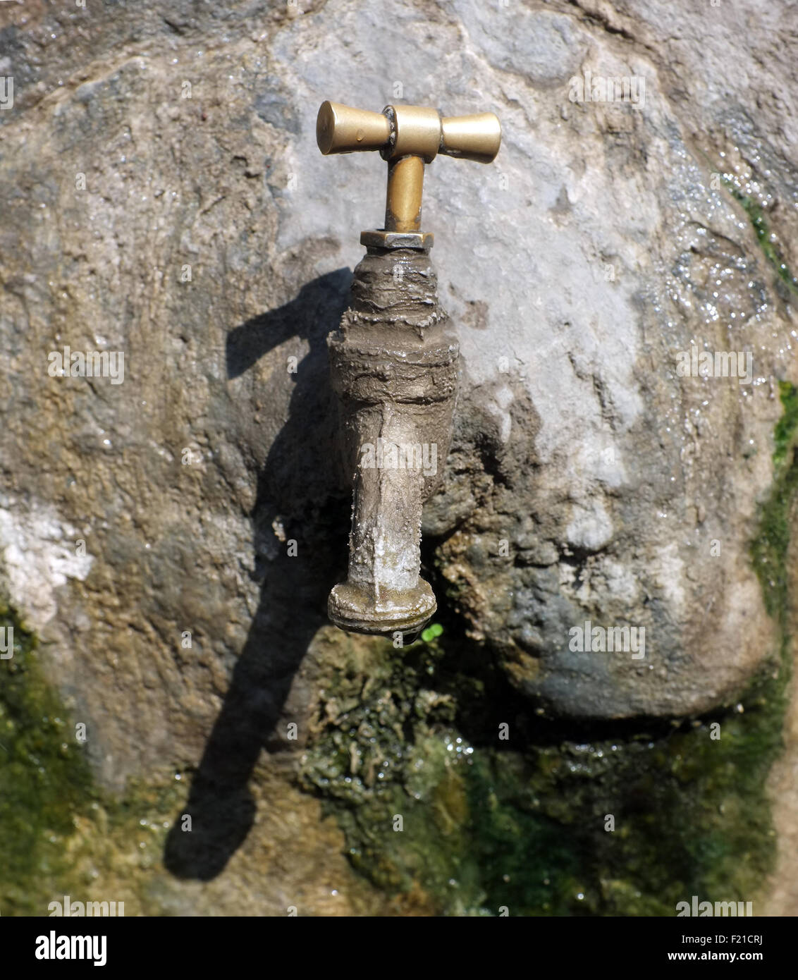 Old tap on the outside wall Stock Photo - Alamy