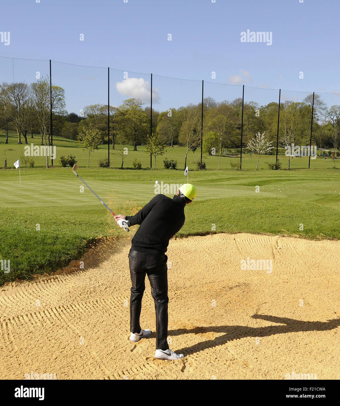 Sports, Ball, Golf, Male Golfer playing from a Bunker at the Practice ...