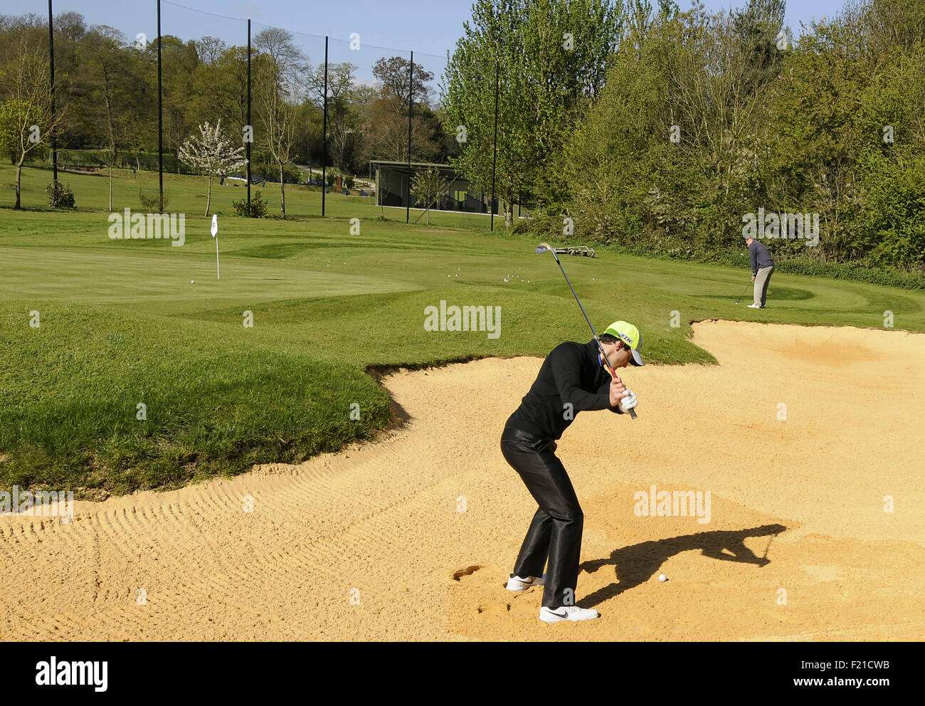 Sports, Ball, Golf, Male Golfer playing from a Bunker at the Practice ...