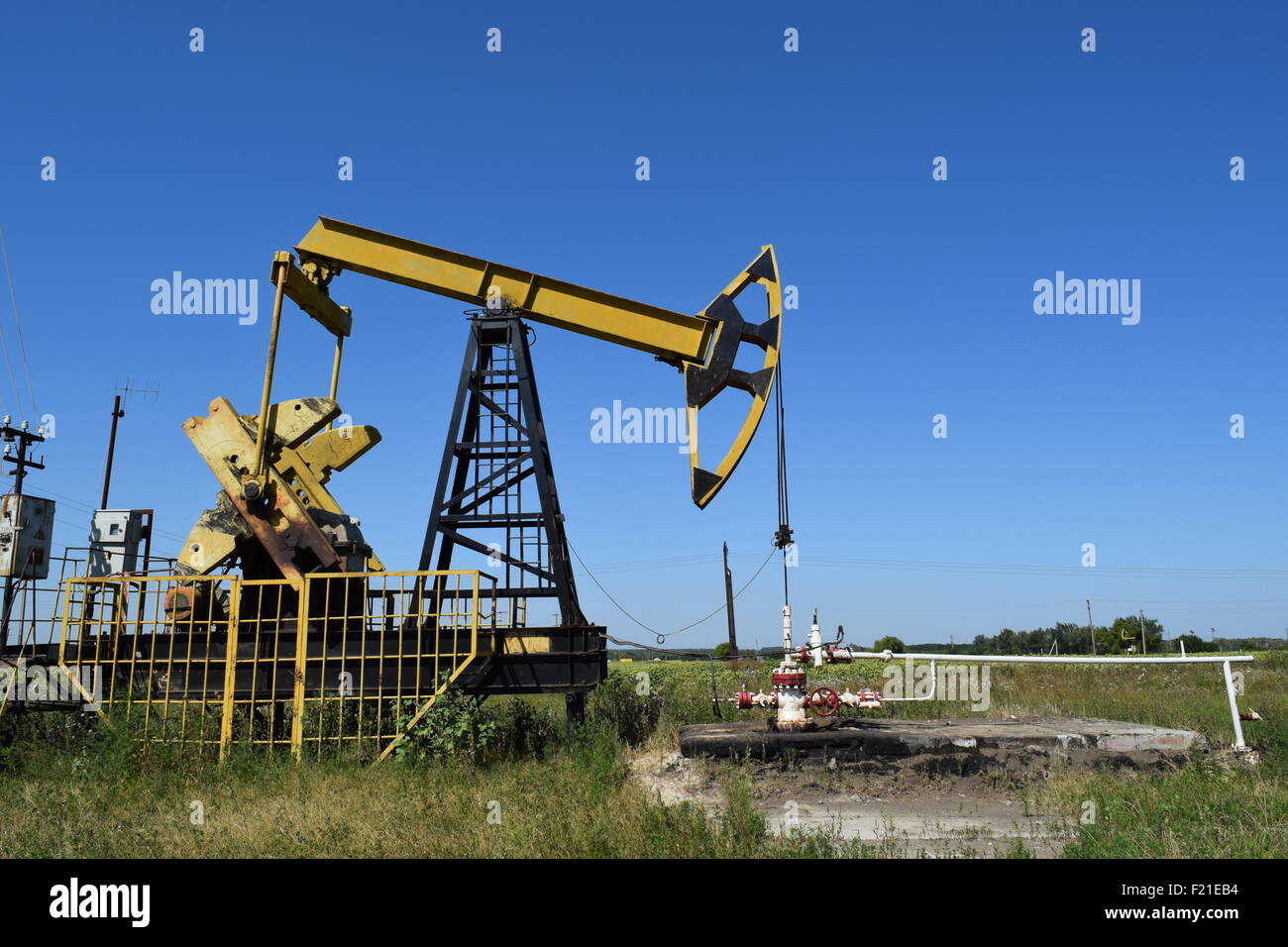 The pumping unit as the oil pump installed on a well. Equipment of oil ...