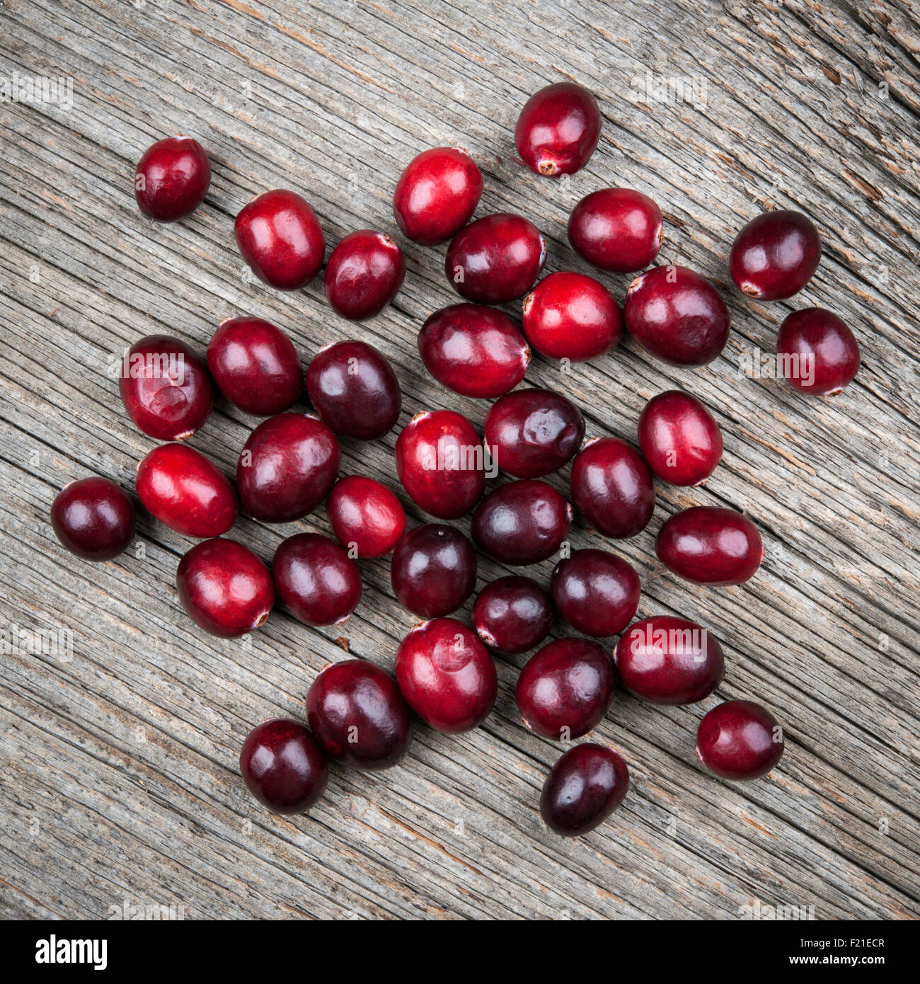 Heap of fresh red ripe cranberries on rustic wood background, square ...