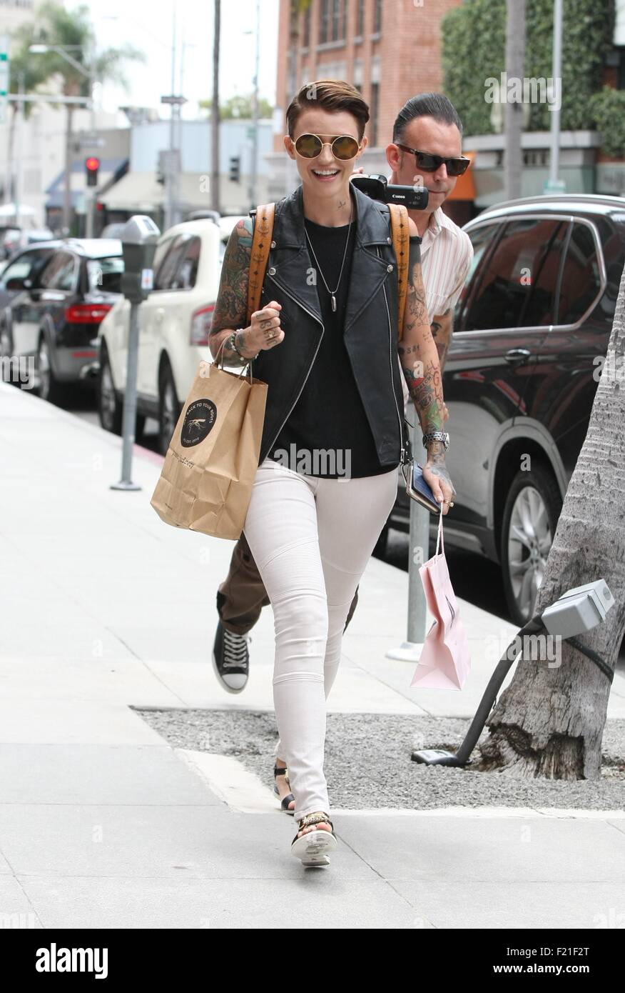 Ruby Rose wearing white skinny jeans and a leather jacket at Anastasia ...