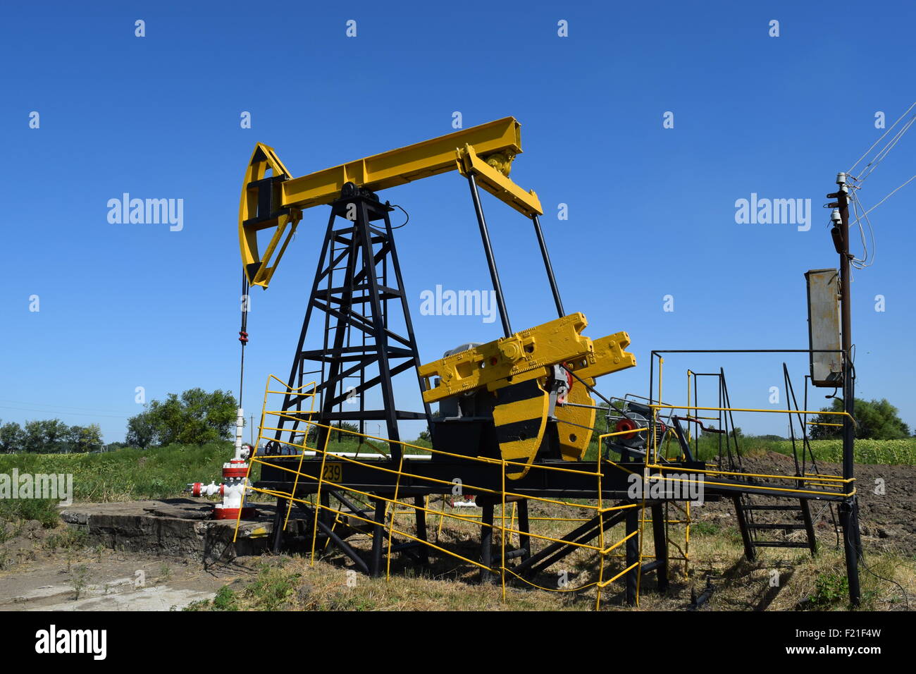 Pumping unit as the oil pump installed on a well Stock Photo - Alamy