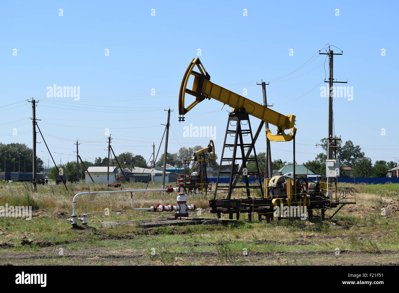 Pumping unit as the oil pump installed on a well Stock Photo - Alamy