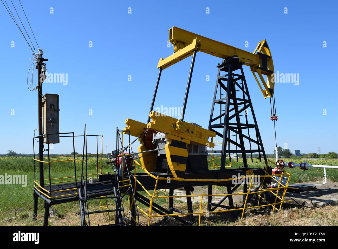 Pumping unit as the oil pump installed on a well Stock Photo - Alamy