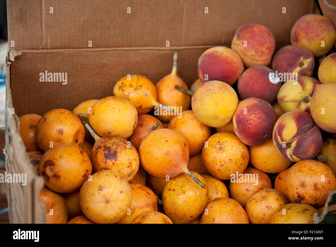 A bunch of passion fruit in peru also known as maracuja Stock Photo - Alamy