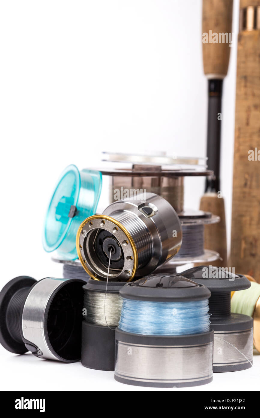 fishing rods and spools with line for reels on white background Stock ...