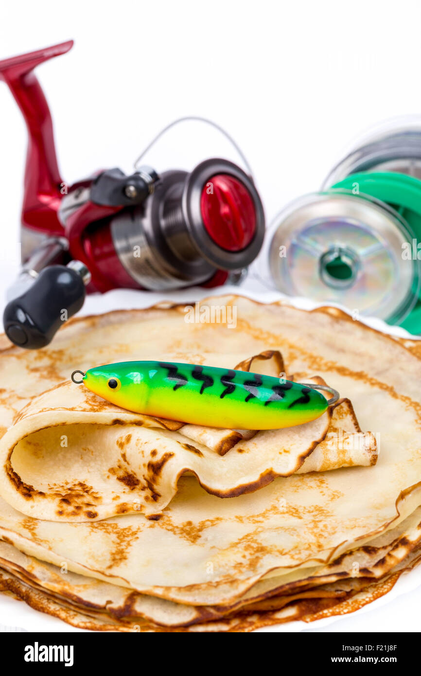 fishing tackles reel, line and lure with king of pancakes Stock Photo ...