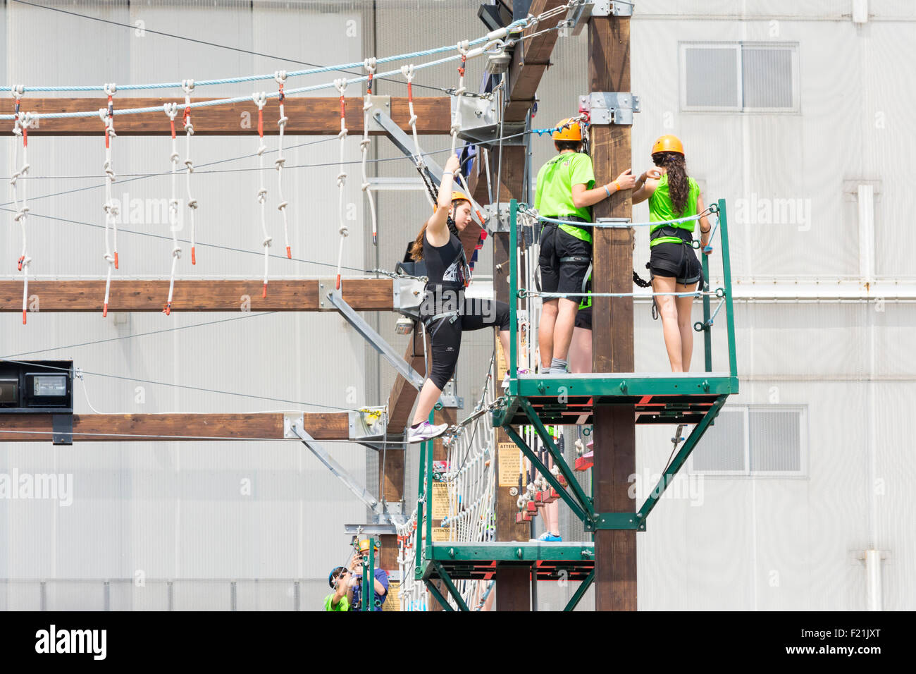 Bologna,Italy-May 31,2015:Group of people hanging on a equipped path ...