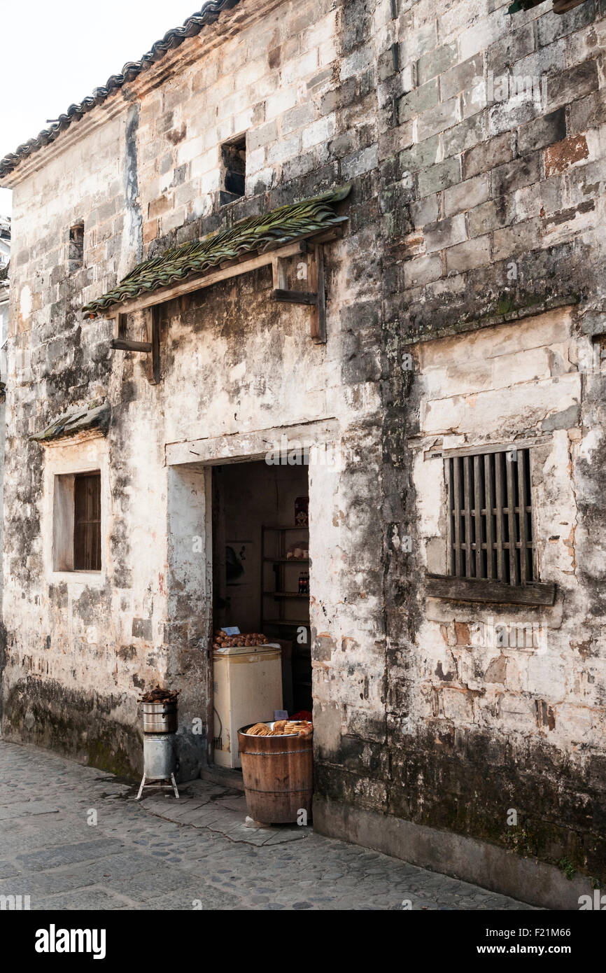 Ancient brick building currently used as a store in Hongcun village ...
