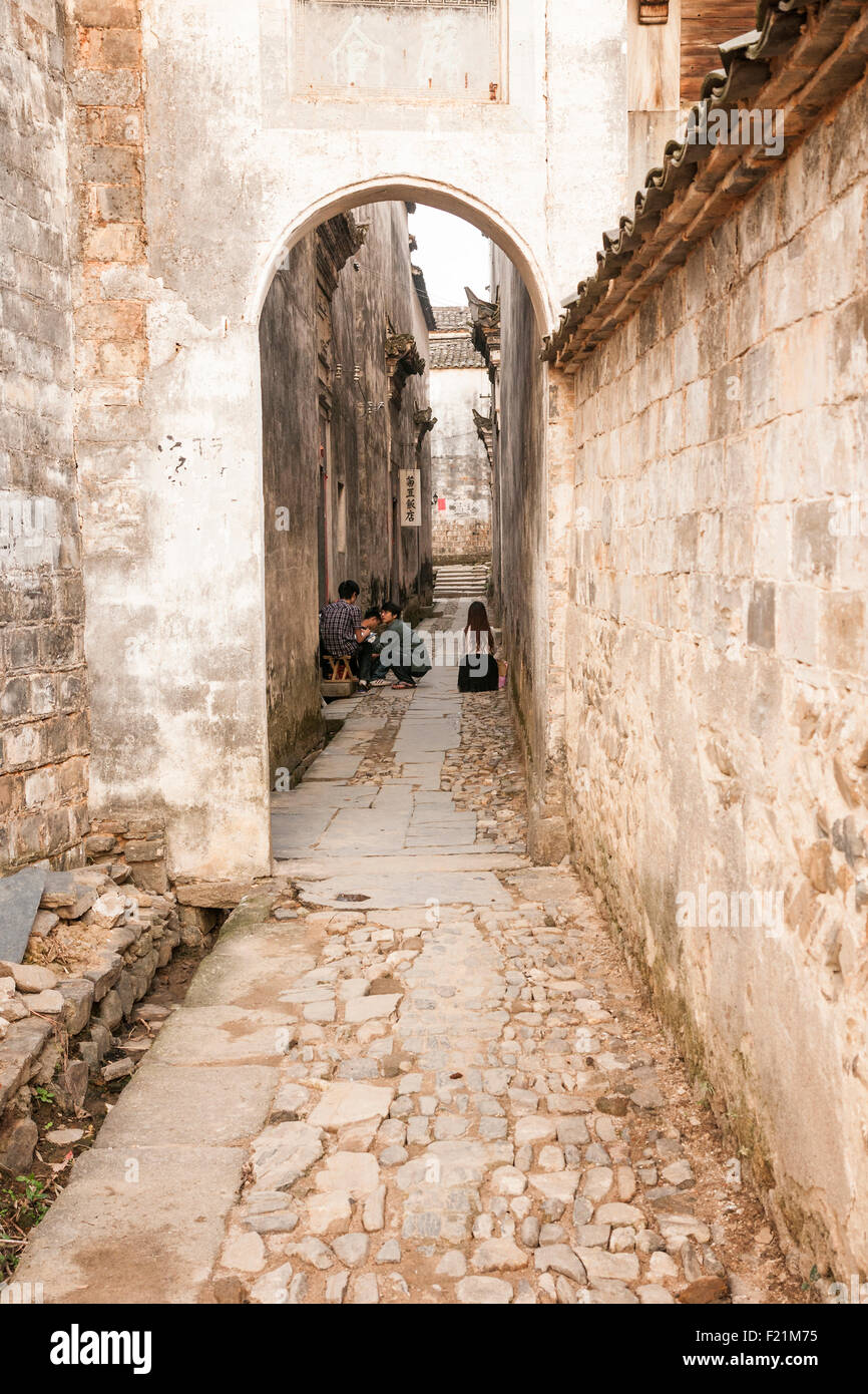 Narrow cobblestone lane with arched passageway in Nanping village ...