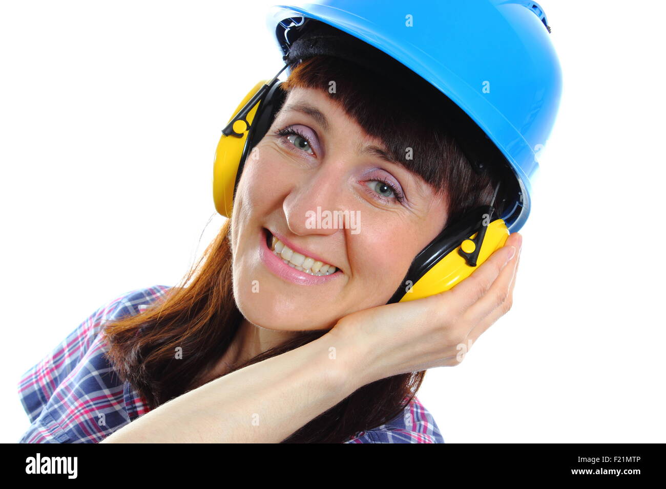 Female construction worker wearing blue helmet and protective ...